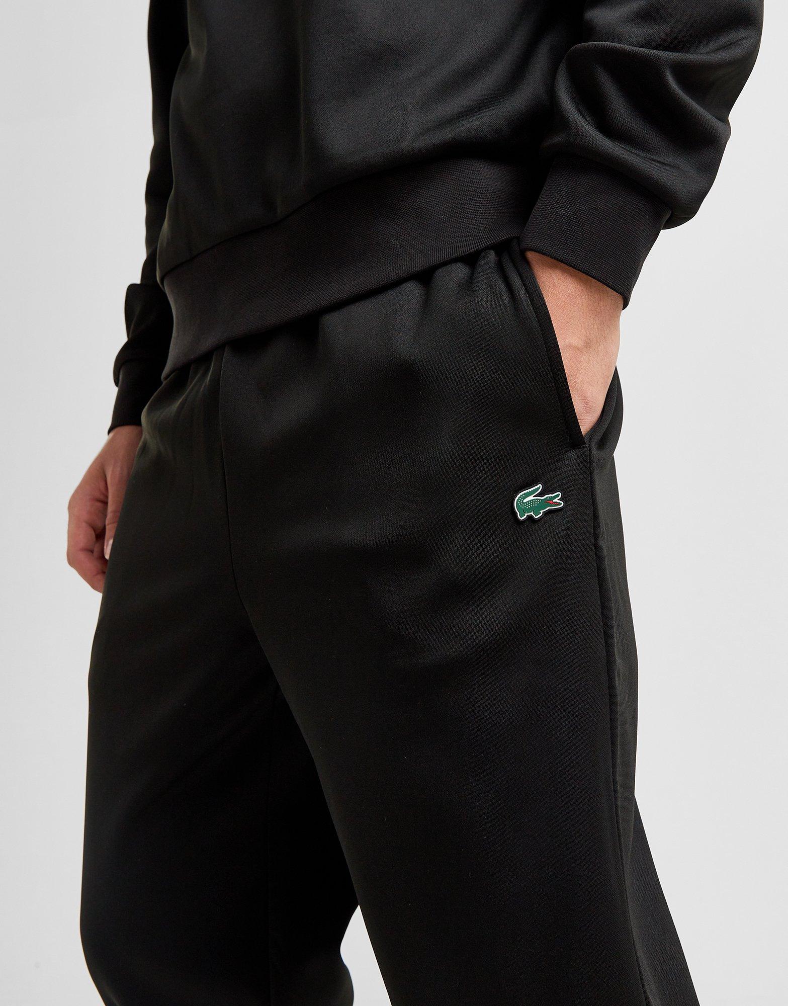 Black lacoste track pants store