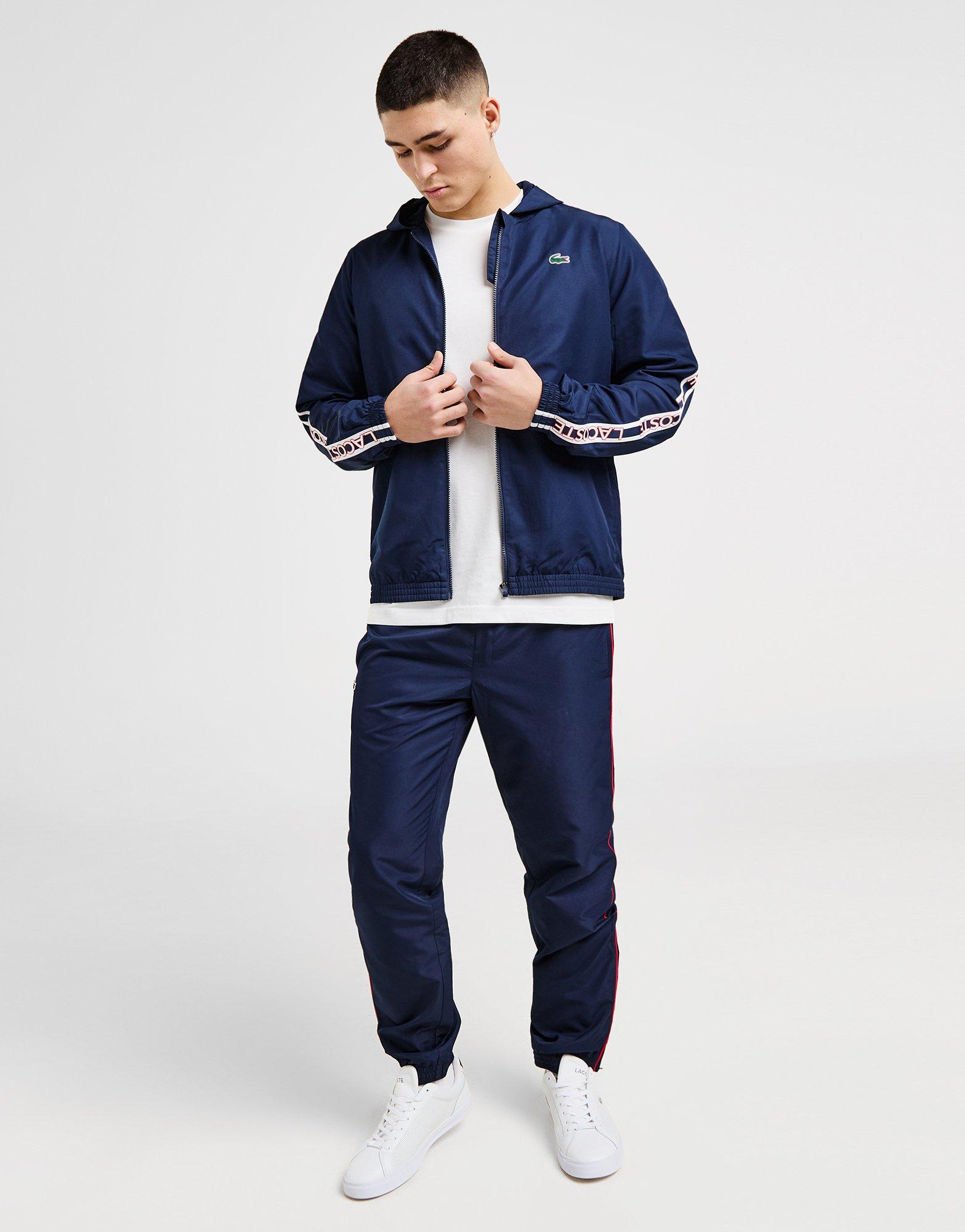 Lacoste Tuta Completa con Cappuccio Taffeta Taped in Blu - JD Sports Italia