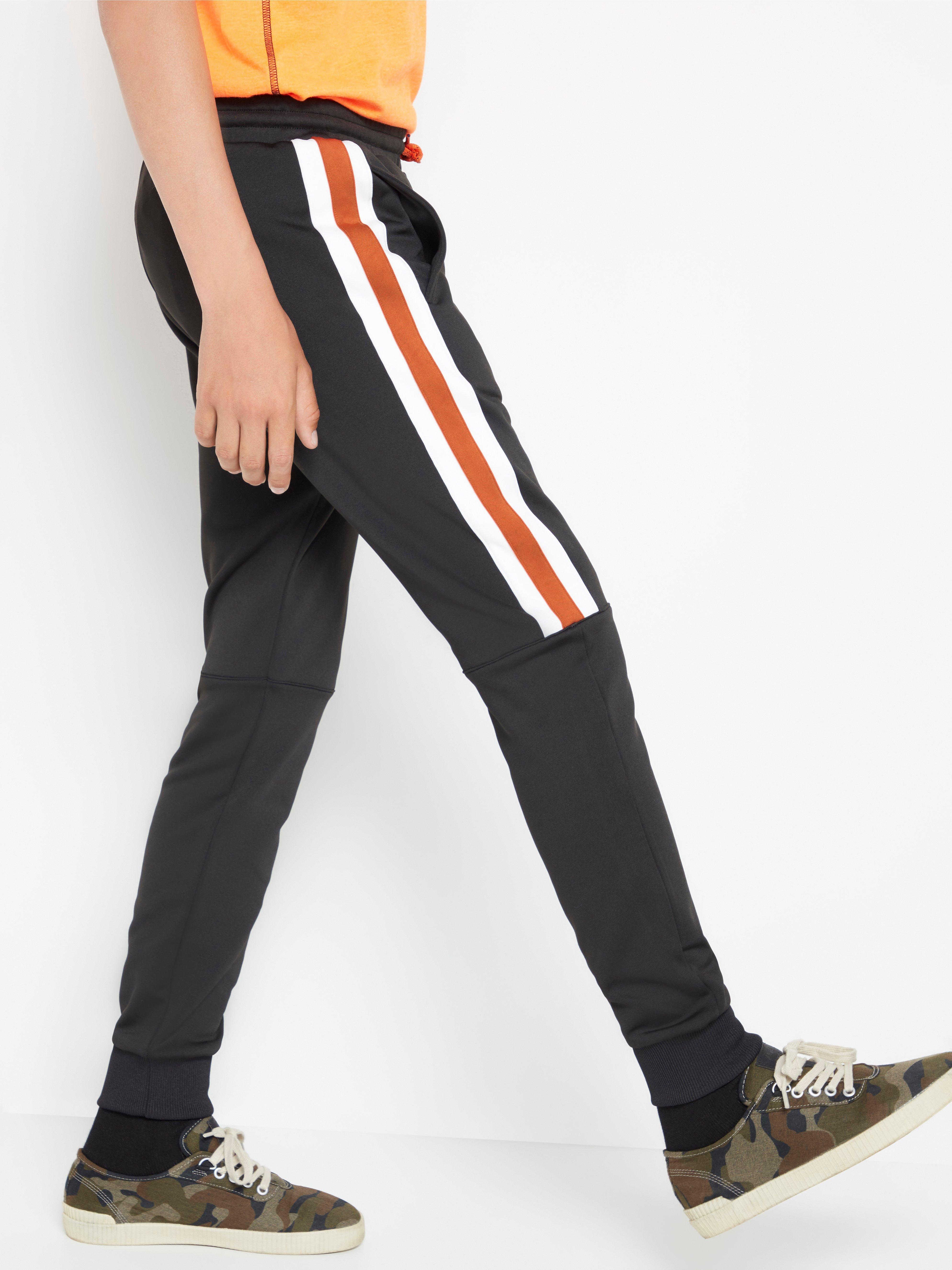 Black WCT track pants with side stripes | Lindex
