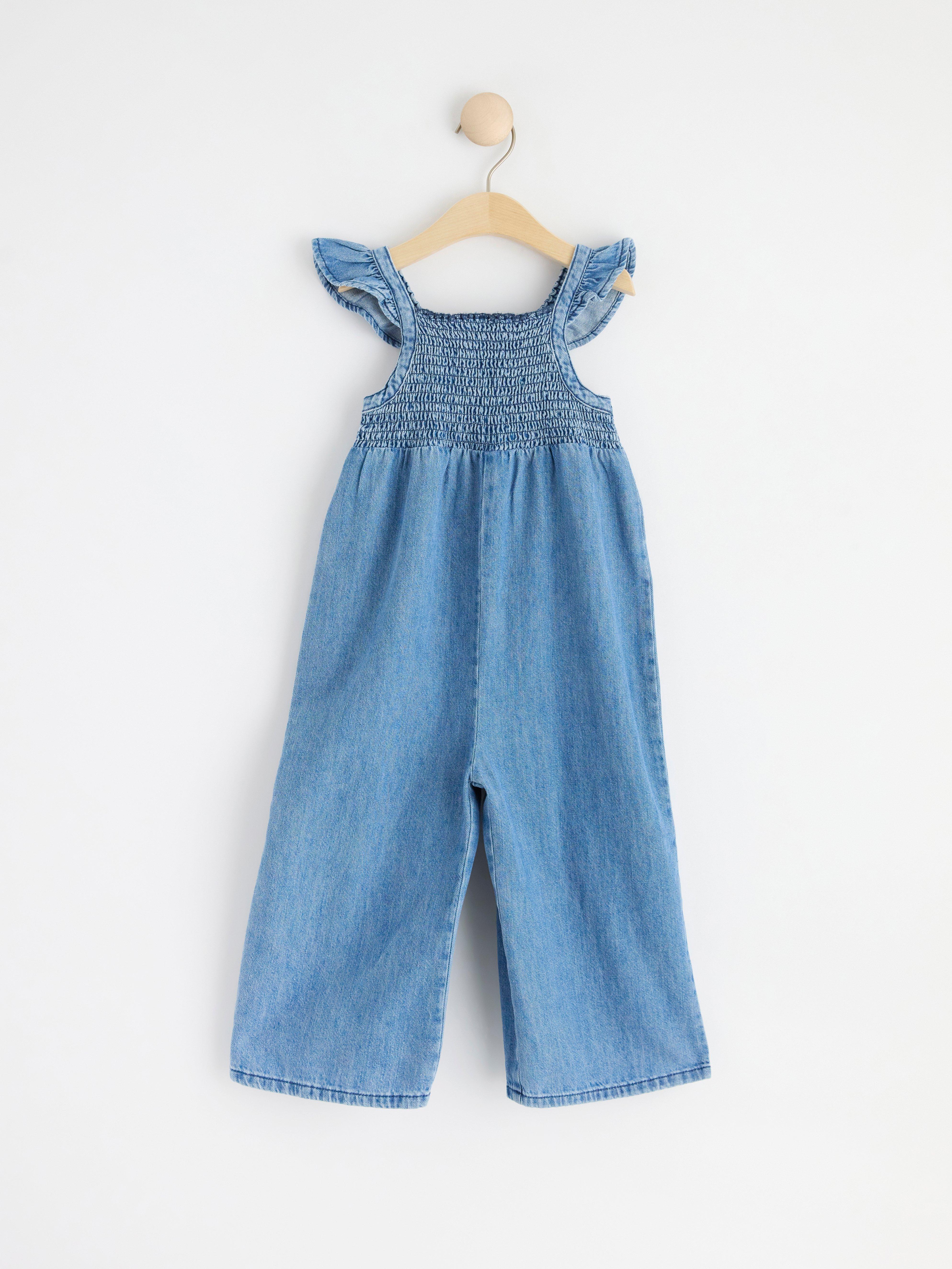Jumpsuit av denim med vaffelsøm | Lindex